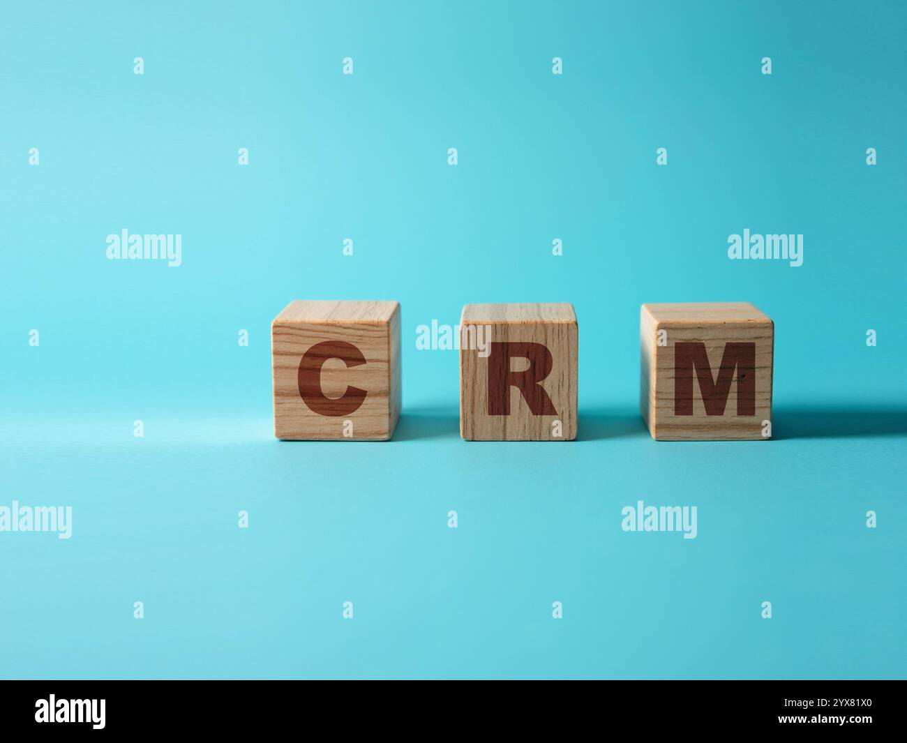 wood cube block with text CRM - Customer Relationship Management. the ...