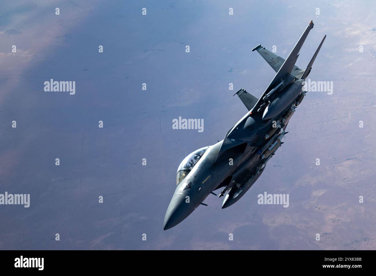 A U.S. Air Force F-15E Strike Eagle flies over the U.S. Central Command ...
