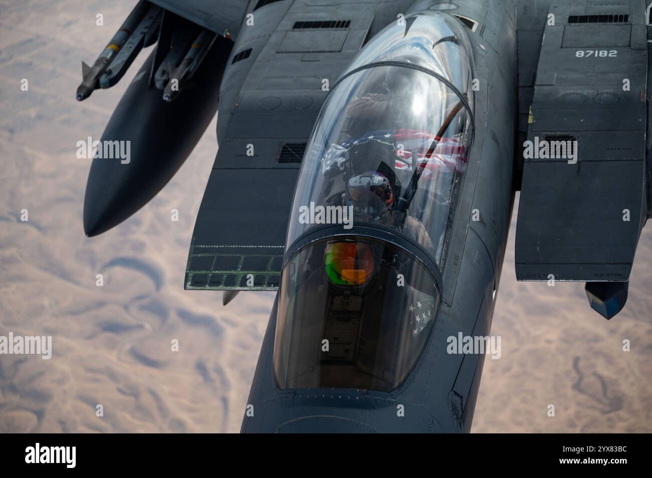 A U.S. Air Force F-15E Strike Eagle flies over the U.S. Central Command ...