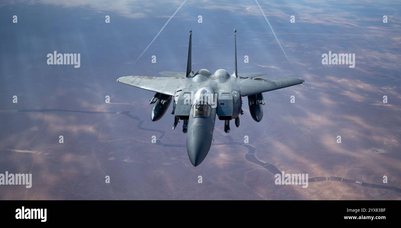 A U.S. Air Force F-15E Strike Eagle flies over the U.S. Central Command ...