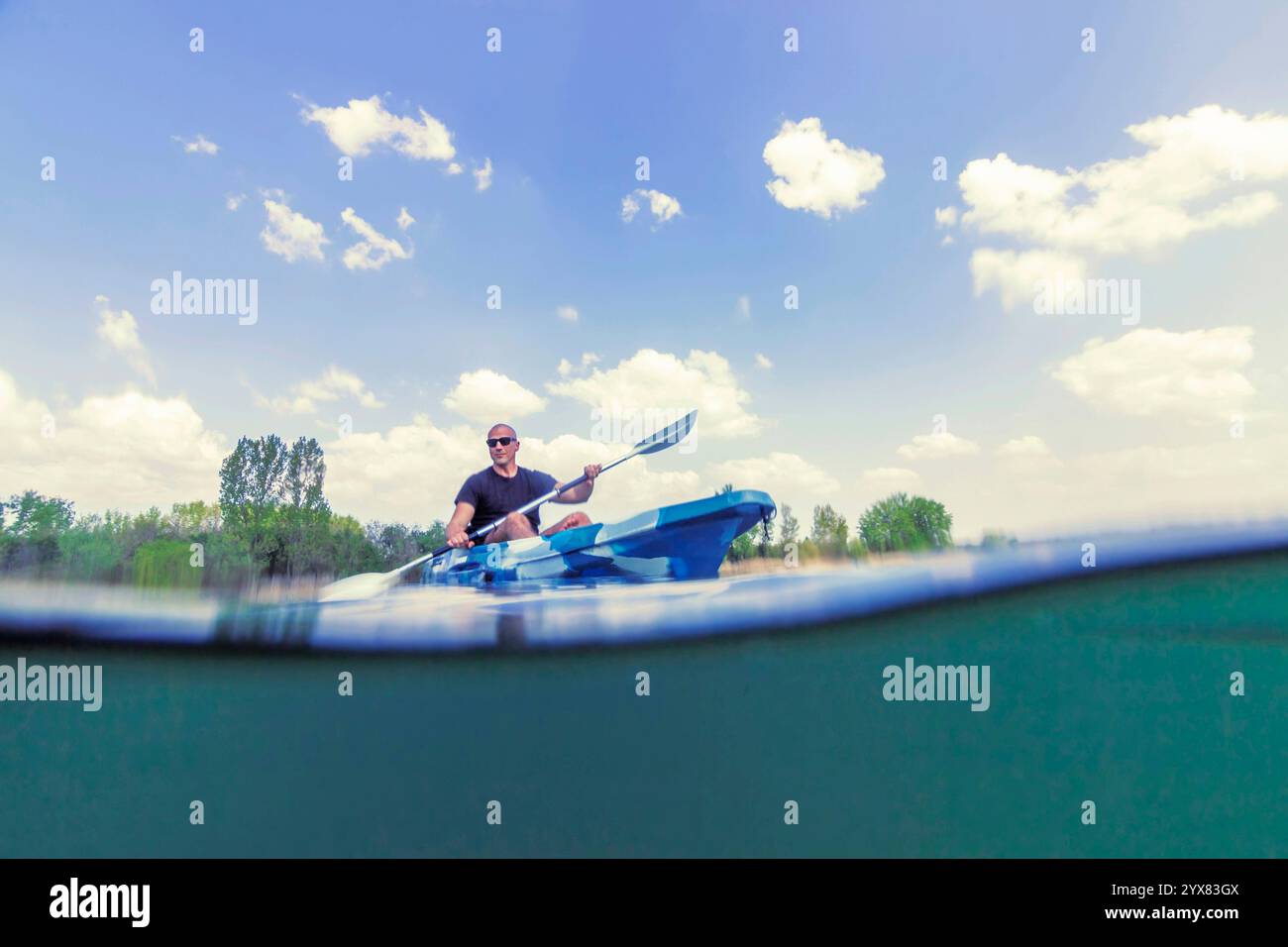 Young Man Kayaking on Lake, Kayaking Underwater View, Split Shot. Young ...