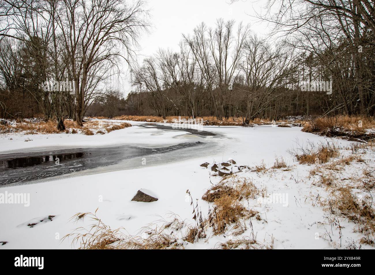 Big Rib River partially frozen in central Wisconsin, horizontal Stock ...