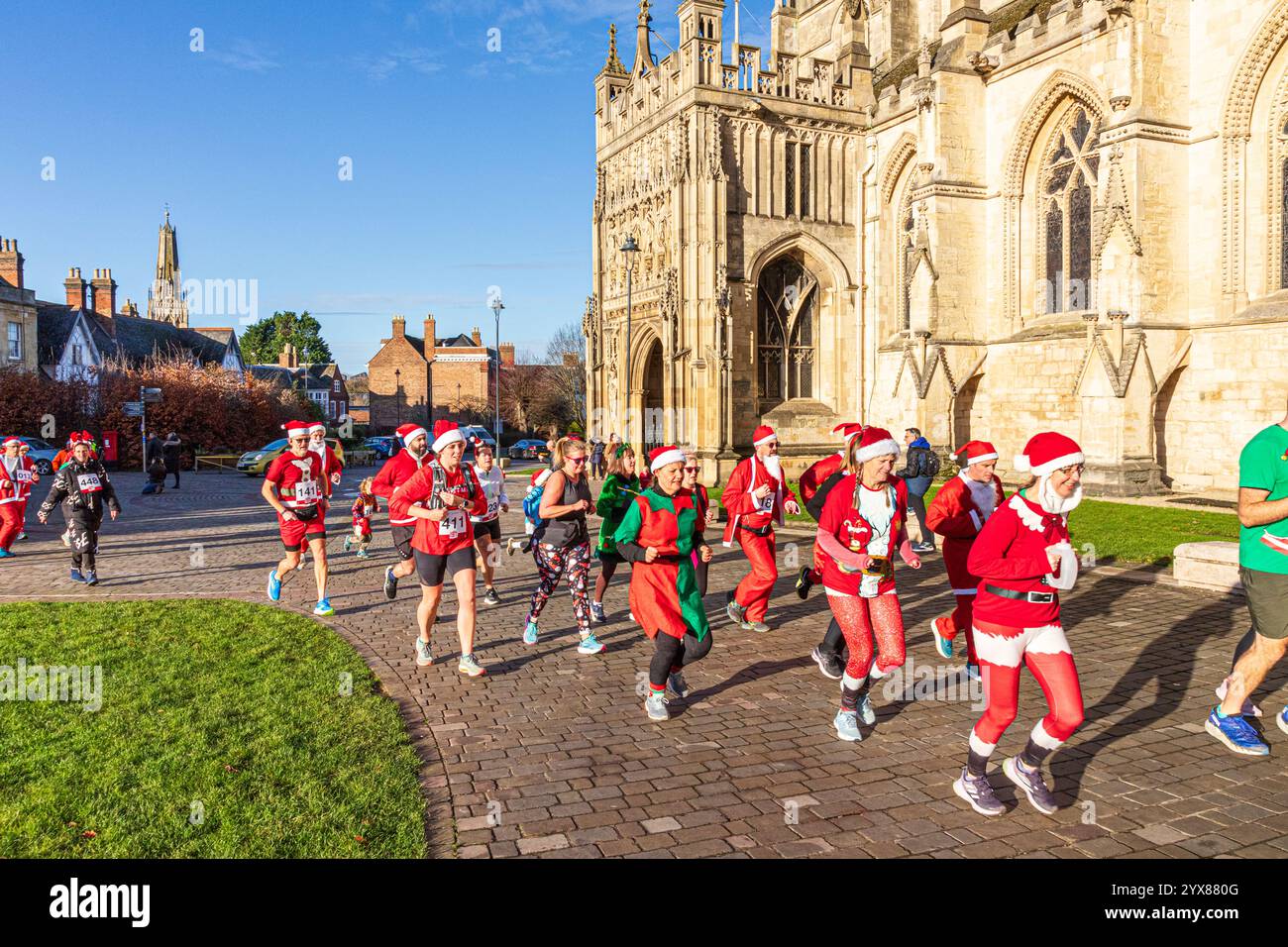 Some of the 600+ Santas passing the Cathedral while running the Santa ...