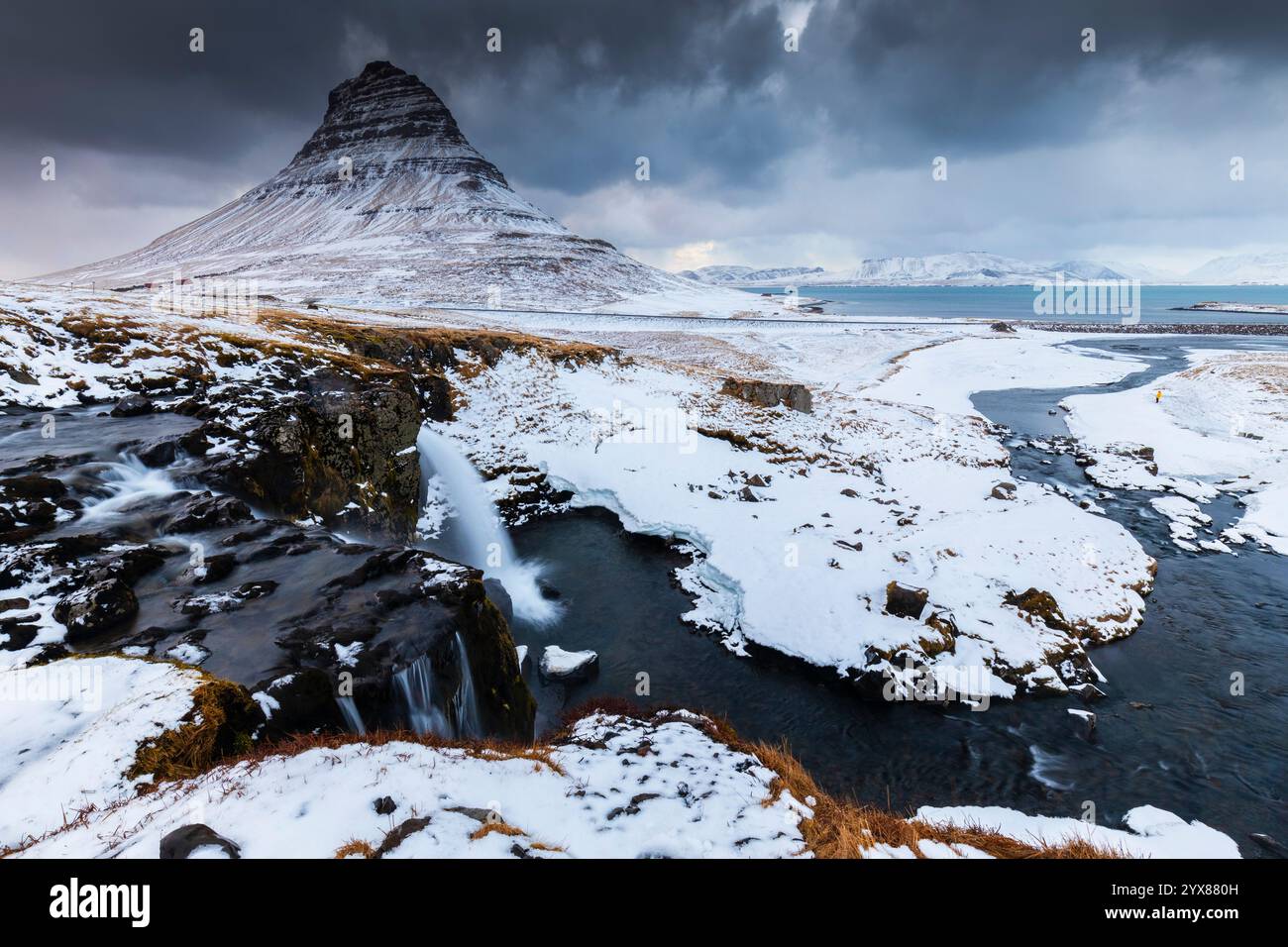 View of Kirkjufell mount at sunset in winter. Grundarfjörður ...
