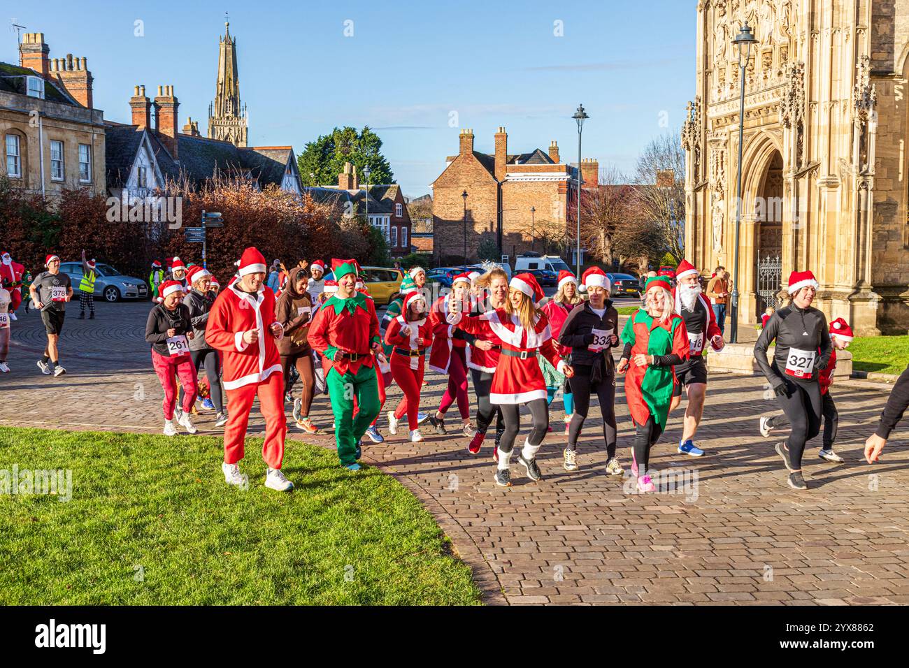 Some of the 600+ Santas passing the Cathedral while running the Santa ...