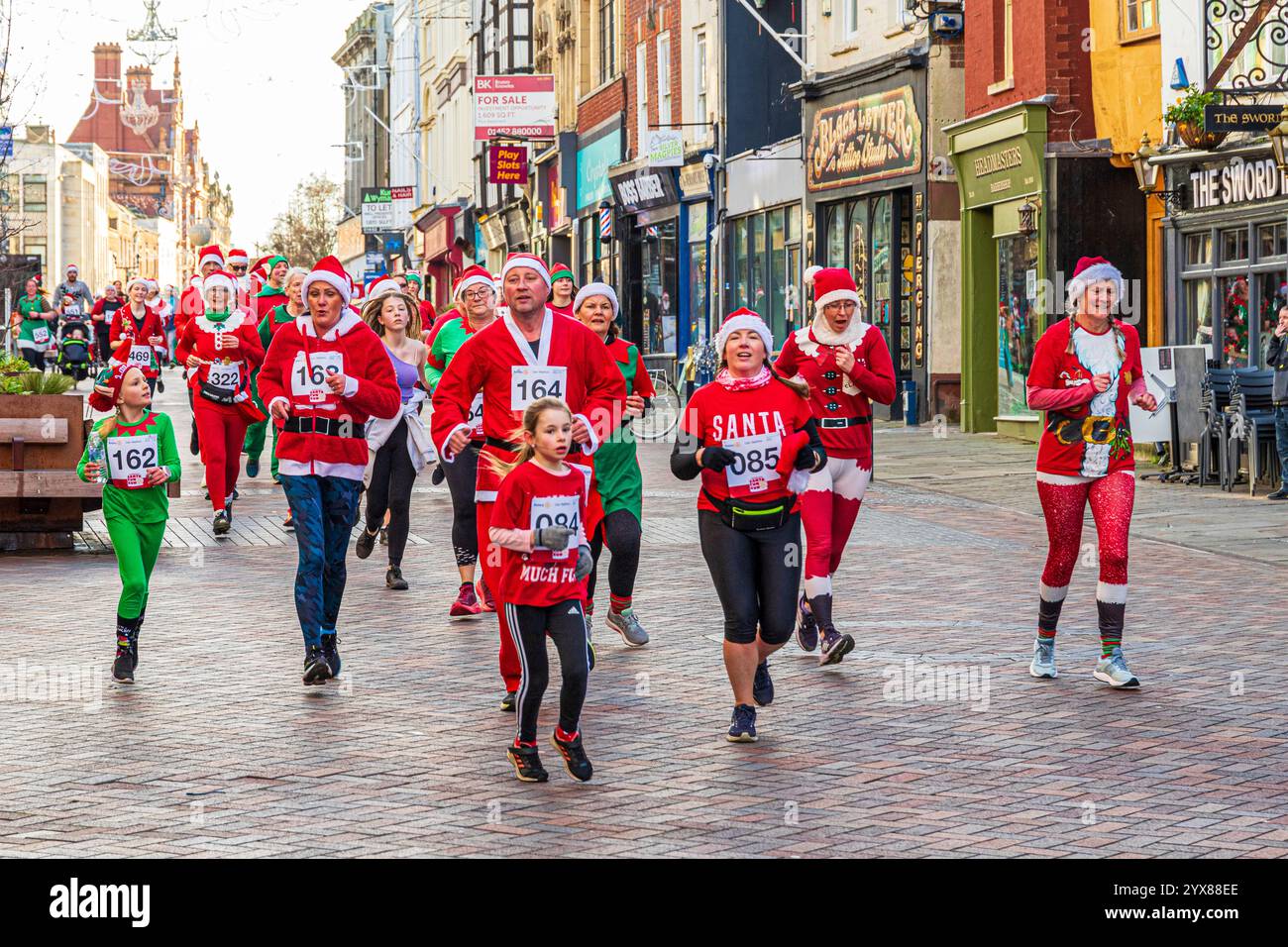 Some of the 600+ Santas in Westgate Street while running the Santa Fun ...