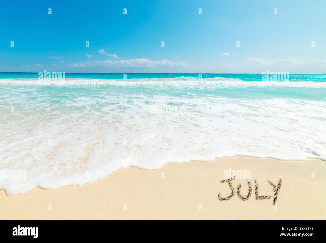 July written on the sand in a tropical beach Stock Photo - Alamy