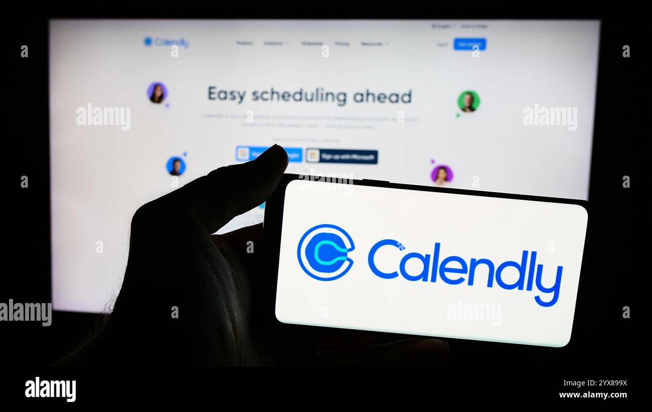 In this photo illustration, a person is holding a mobile phone with the ...