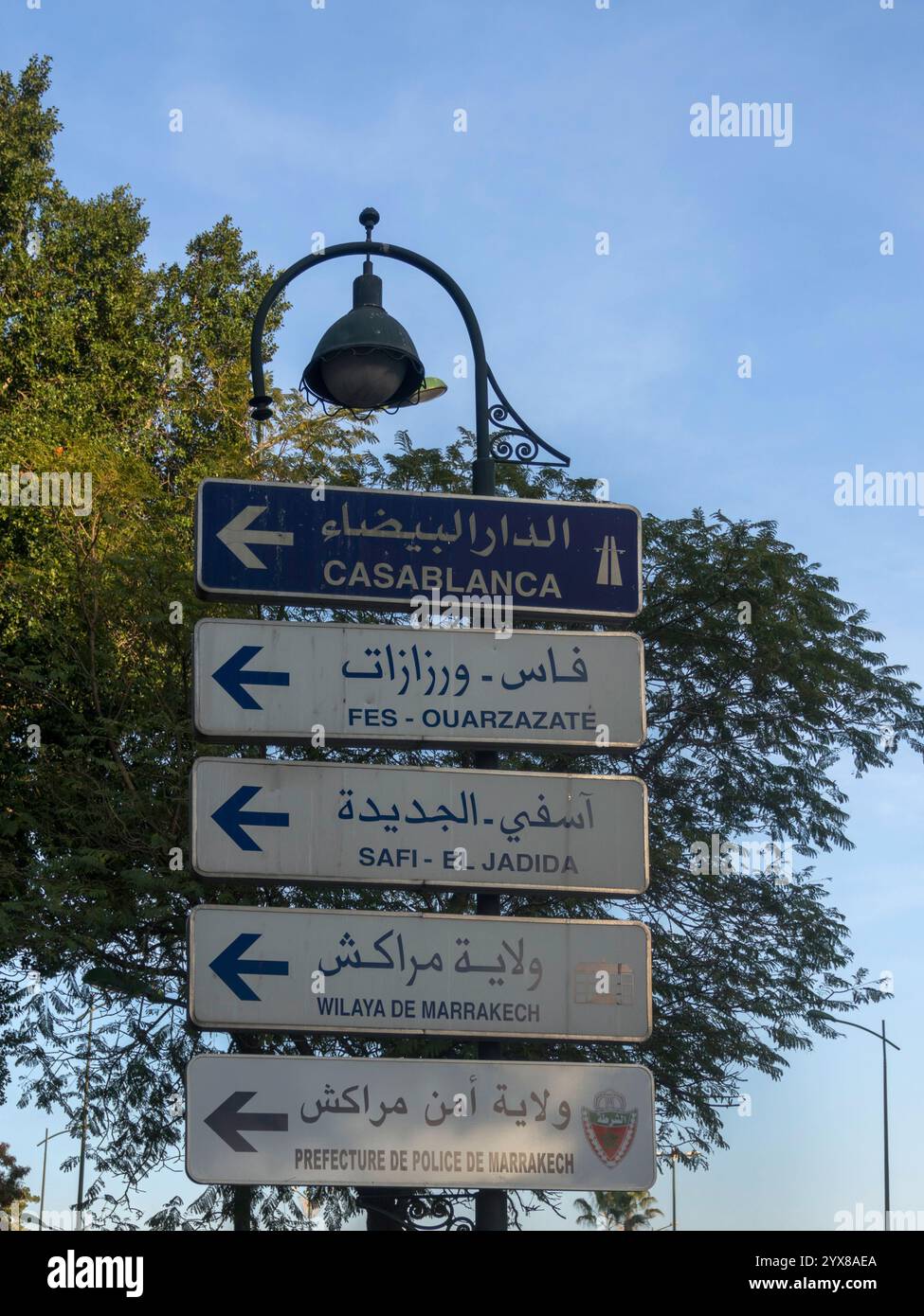 MARRAKECH, MOROCCO - JANUARY 21, 2014: Road sign with directions to ...