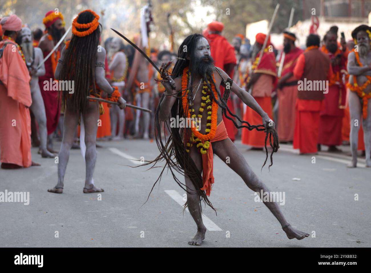 Prayagraj, India. 14 Dec 2024, Naga sadhus take part in a procession ...