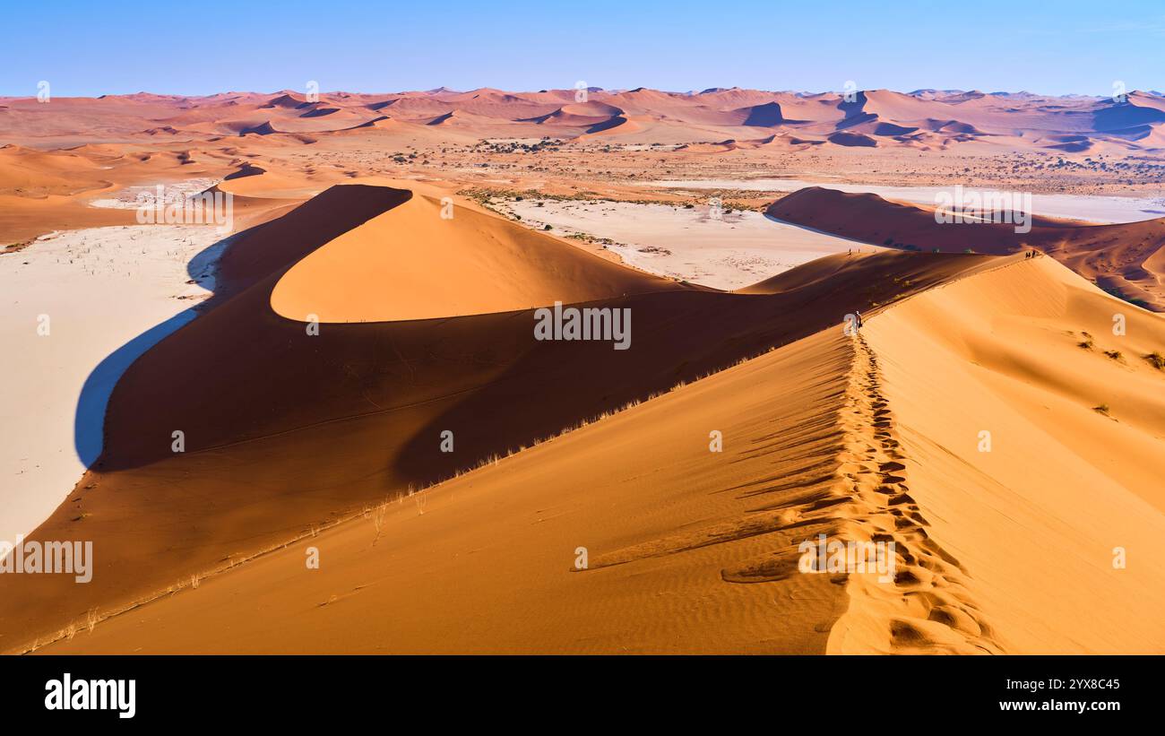 A high-resolution panoramic image of dunes, and footsteps on the ridge ...
