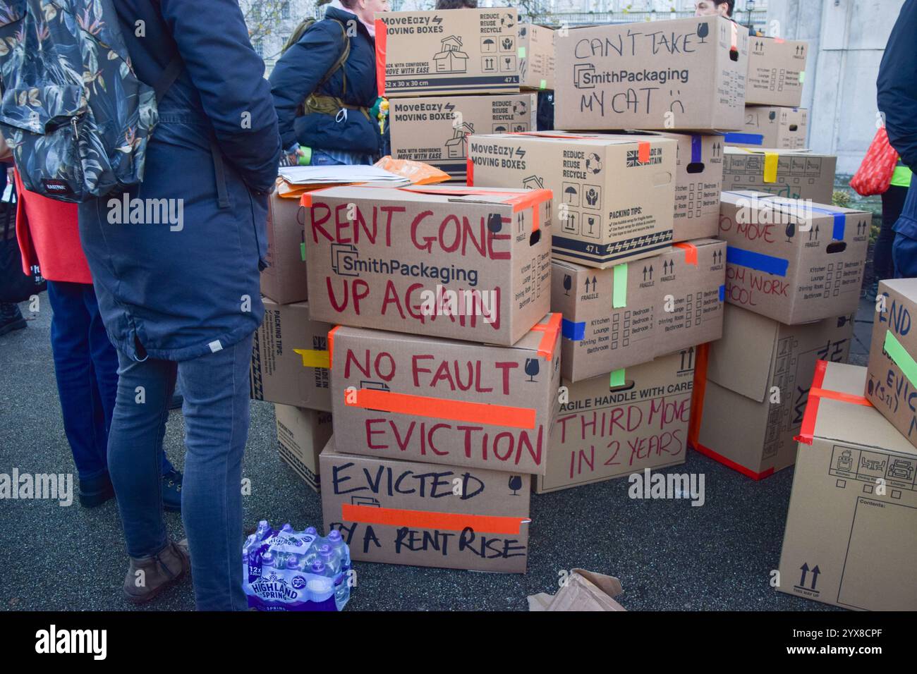London, England, UK. 14th Dec, 2024. Protesters mark boxes with slogans ...
