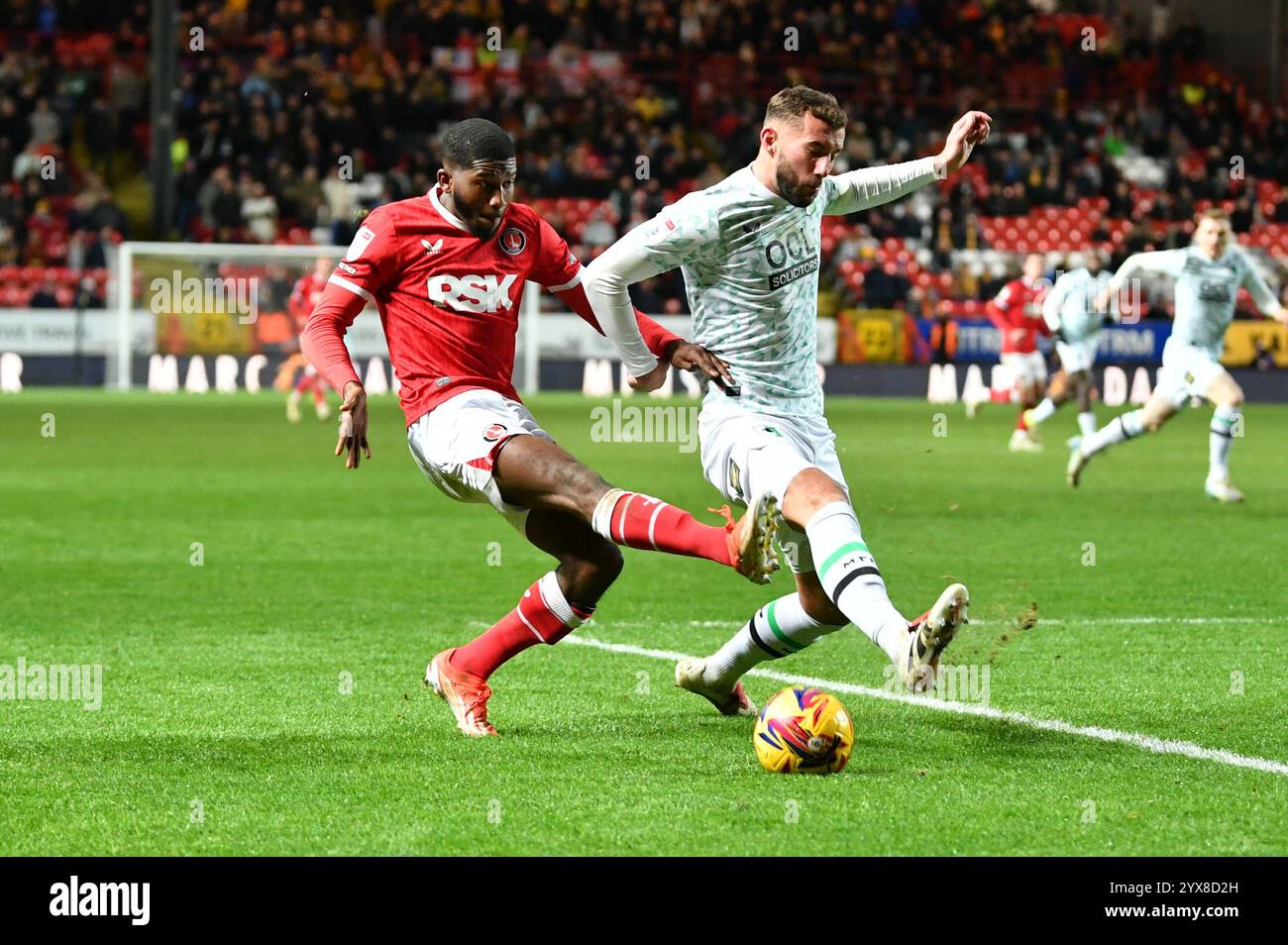 London, England. 14th Dec 2024. Daniel Kanu has a cross blocked by ...