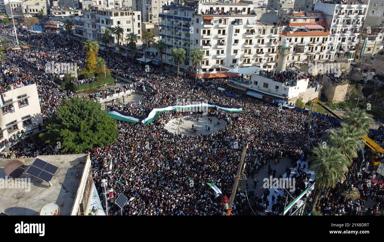 People celebrate in Latakia, Syria after the fall of Syria's Bashar ...