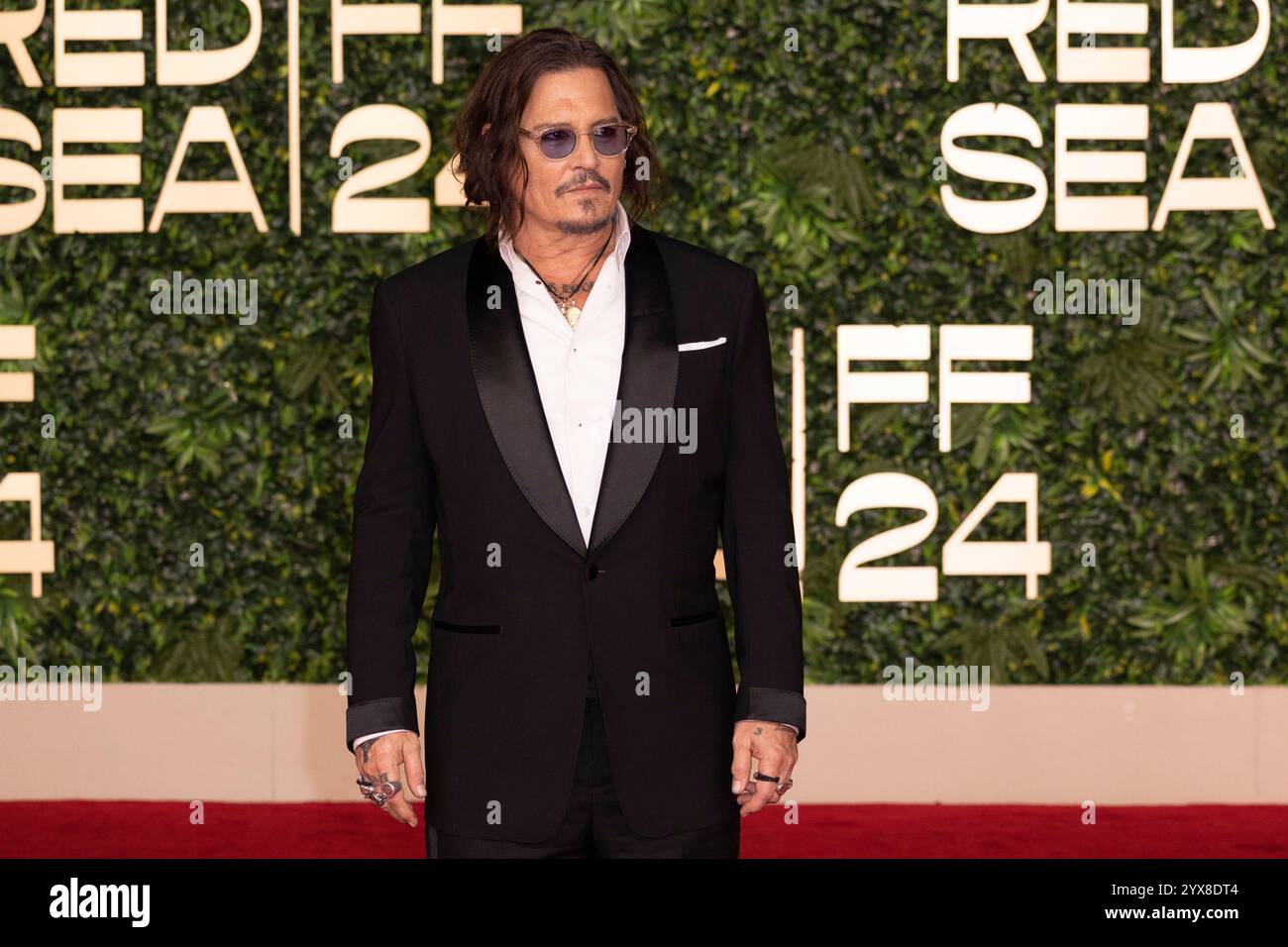 Johnny Depp poses for photographers for the Closing Ceremony red carpet ...
