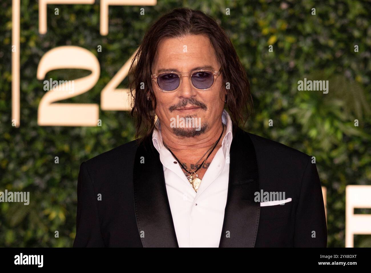 Johnny Depp poses for photographers for the Closing Ceremony red carpet ...
