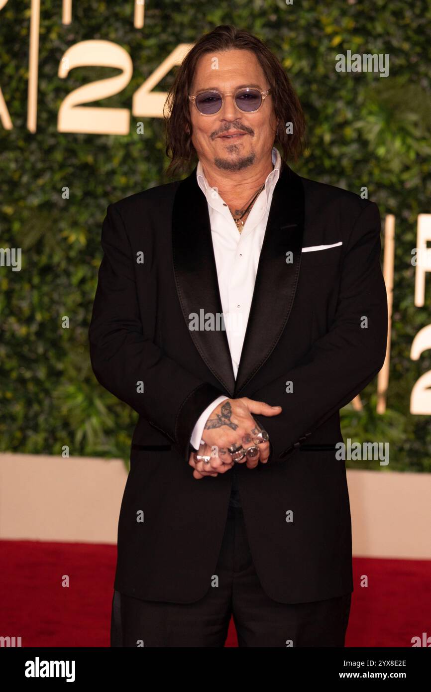 Johnny Depp poses for photographers for the Closing Ceremony red carpet ...