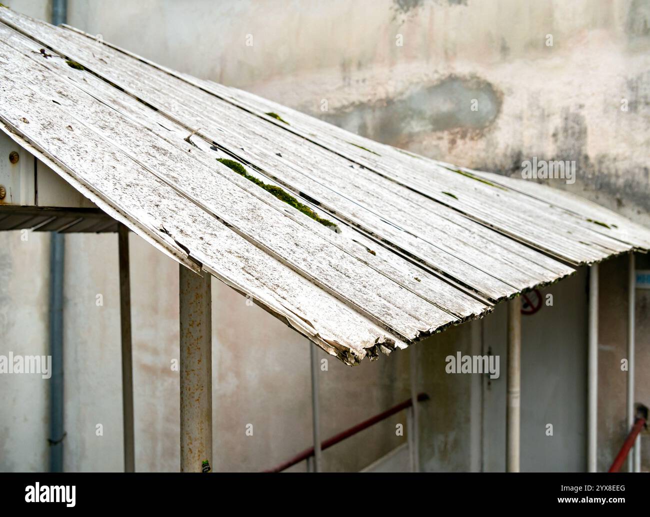 A fragment of the collapsing roof of a street canopy made of plastic ...