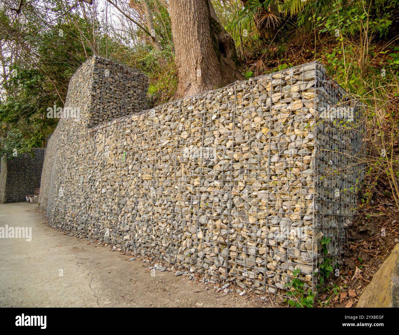 Using gabion as a retaining wall Stock Photo - Alamy