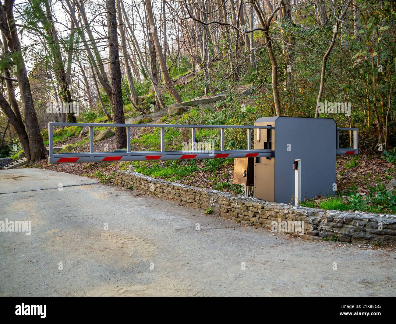 Automatic retractable barrier at the entrance to the protected area ...