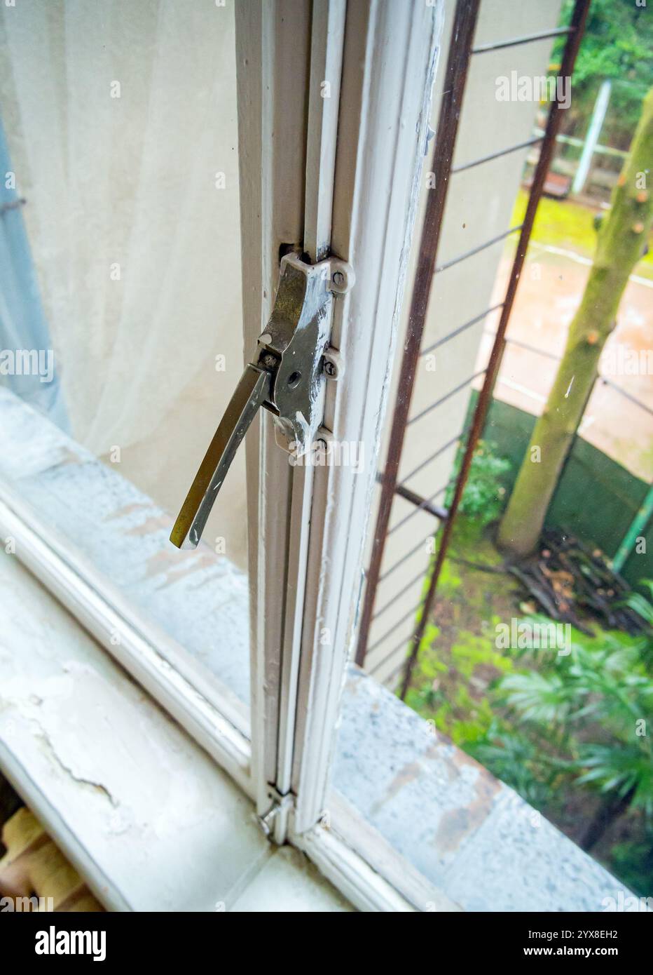 Vertical lock on an old window from the USSR era Stock Photo - Alamy