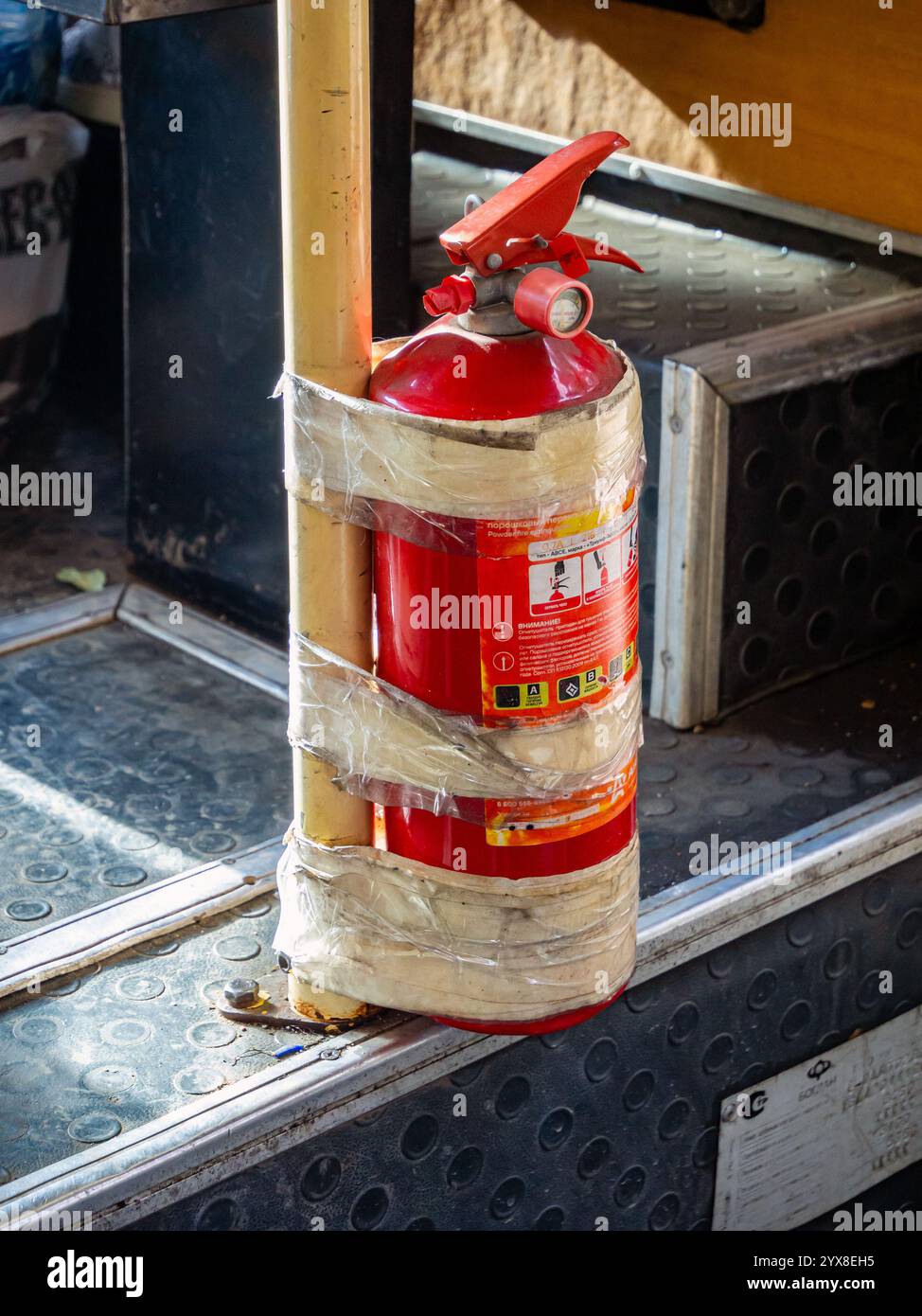 Sochi, Russia - March 24, 2024: A fire extinguisher in public transport ...