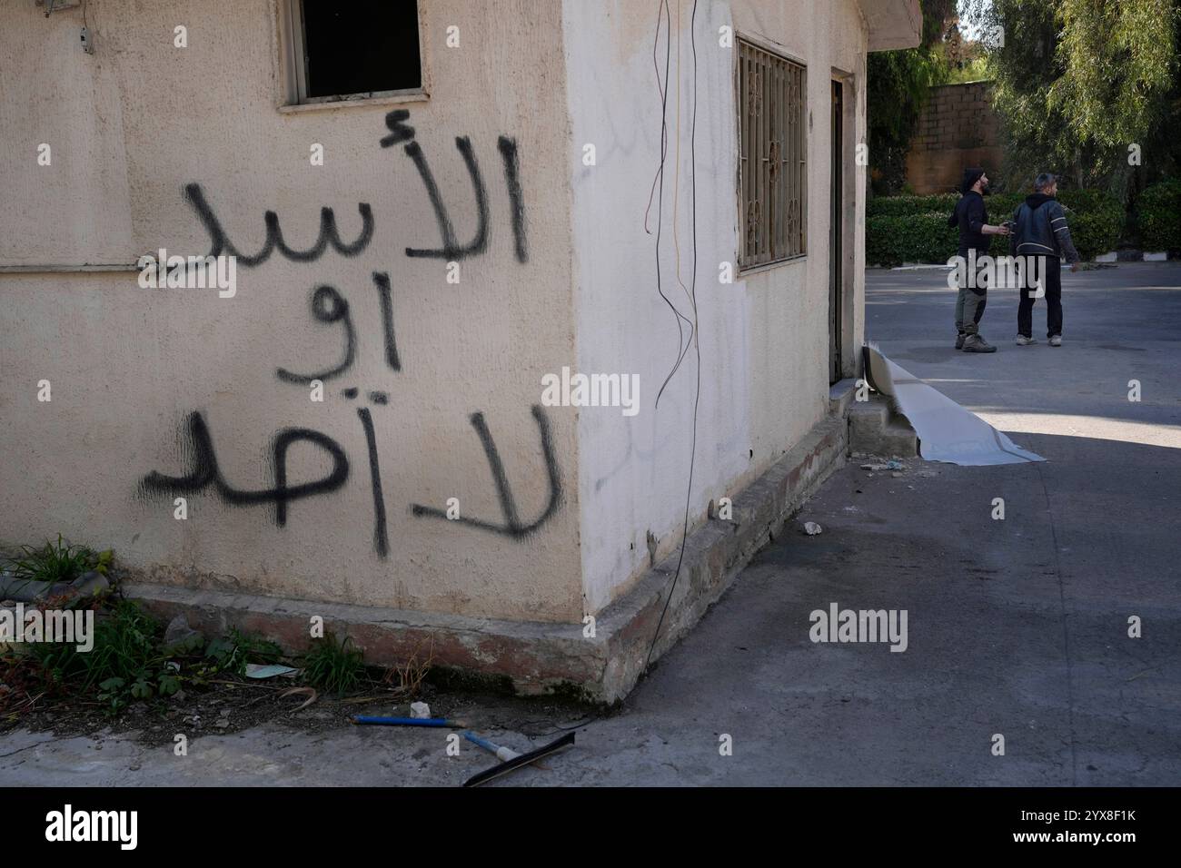 Syrian fighters from rebel group, searche for hidden prison rooms ...