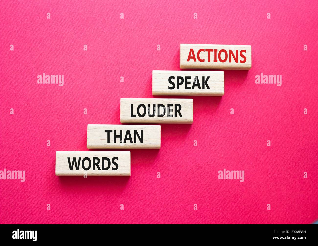 Actions speak louder than Words symbol. Wooden blocks with words ...
