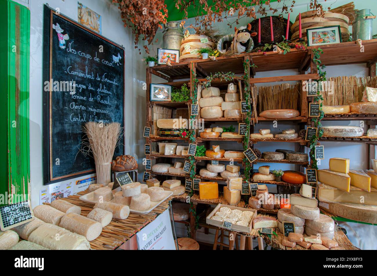 FRENCH CHEESE SHOP FROMAGERIE DISPLAY FRANCE Selection of handmade cheeses on display in the ...
