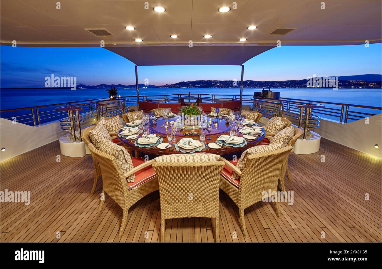 Elegant Dining Setup Aboard a Yacht During Sunset with Scenic Ocean ...