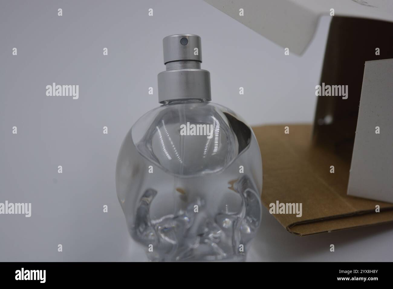 Objects, things, cosmetics and perfumes. A transparent glass bottle of ...