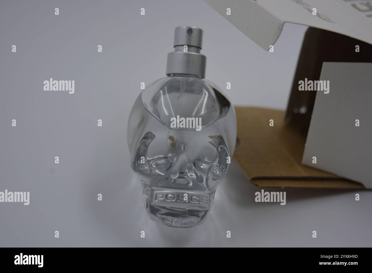 Objects, things, cosmetics and perfumes. A transparent glass bottle of ...