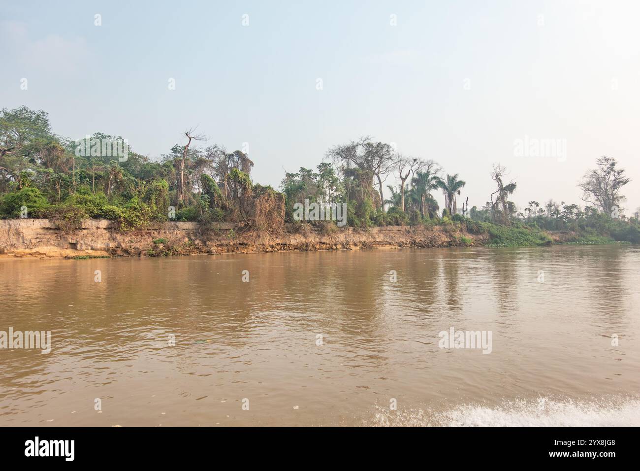Smoke filled atmosphere of the river landscape in the Pantanal Brazil ...