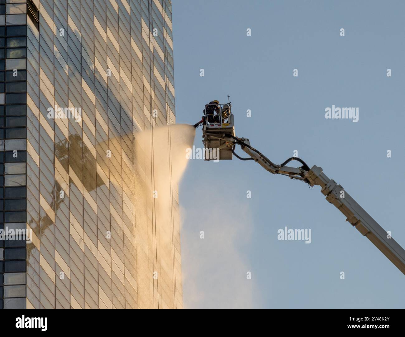 Fire men spraying water during fire fighting emergency exercise on ...