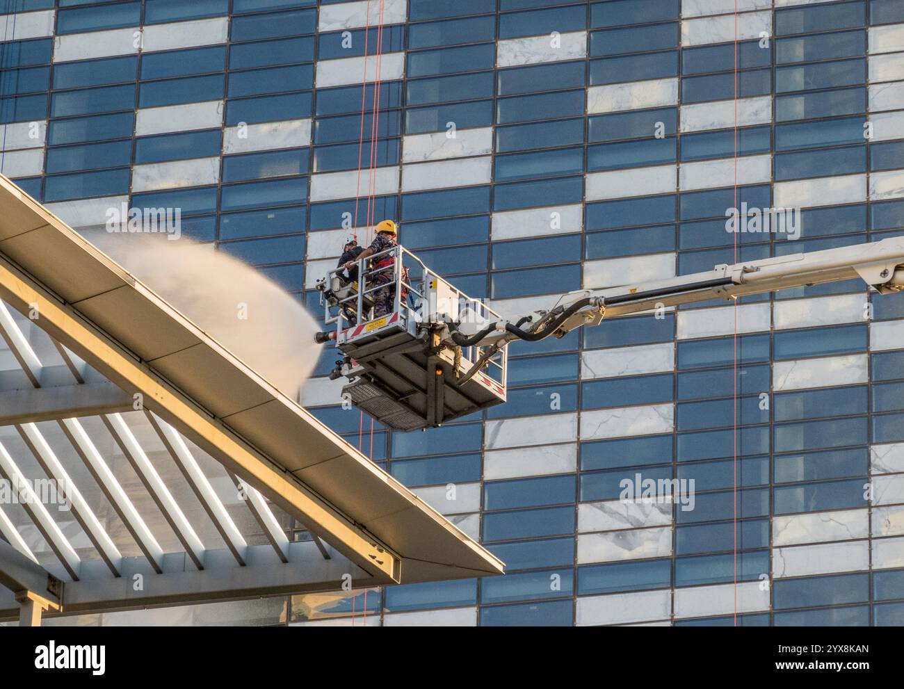 Fire men spraying water during fire fighting emergency exercise on ...