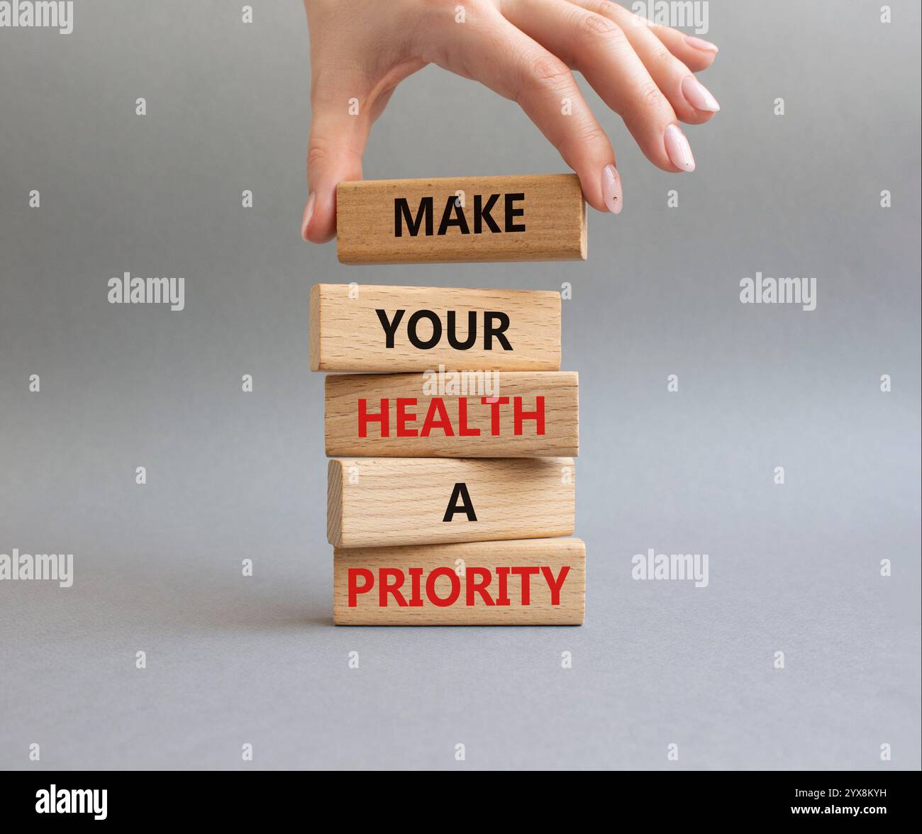 Health symbol. Wooden blocks with words Make your health a Priority ...