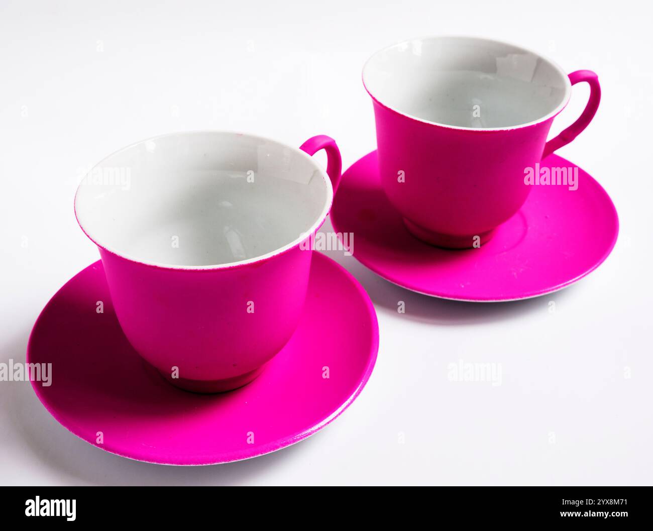 two pink ceramic Cup on white background, isolated Stock Photo - Alamy