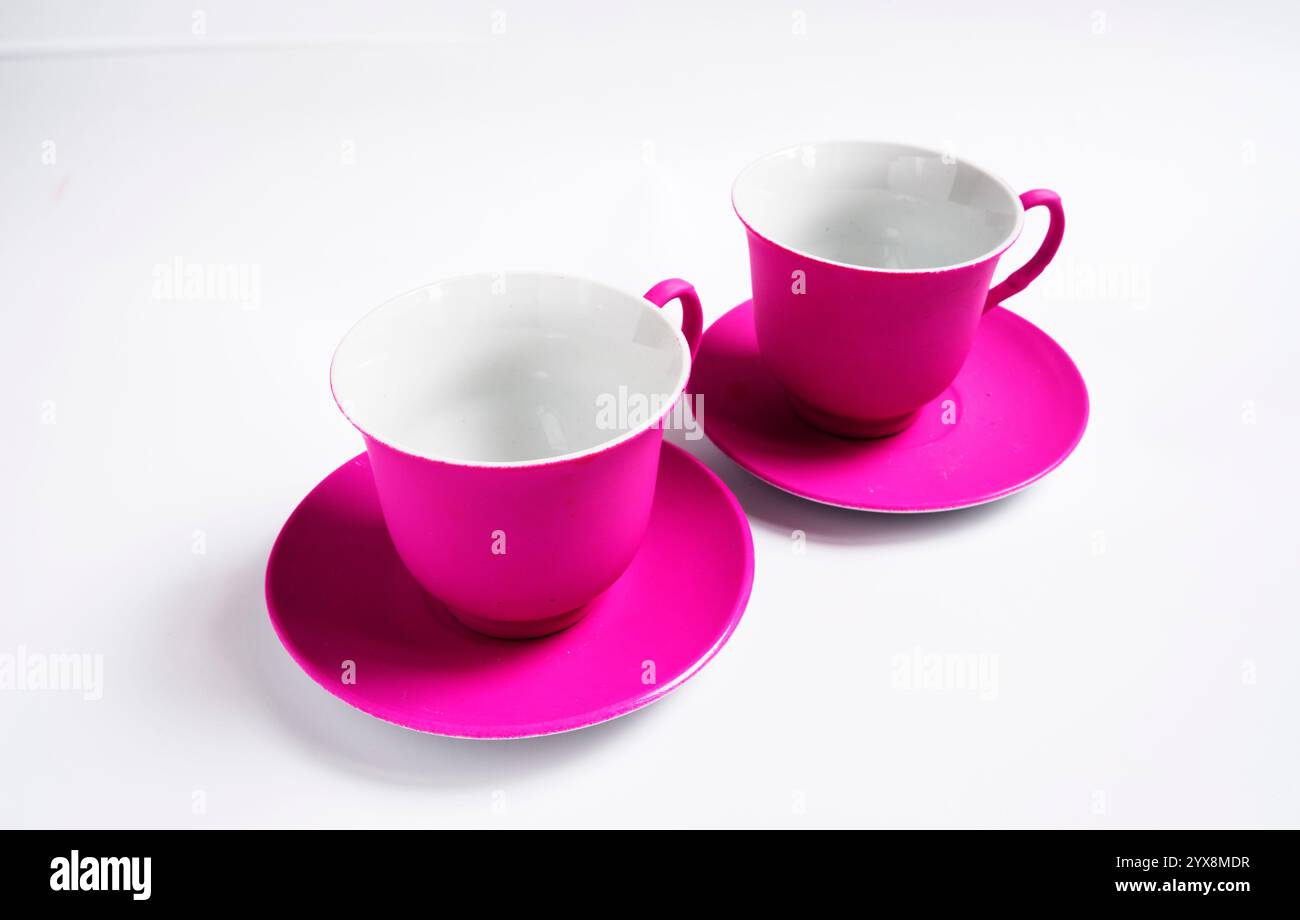 two pink ceramic Cup on white background, isolated Stock Photo - Alamy