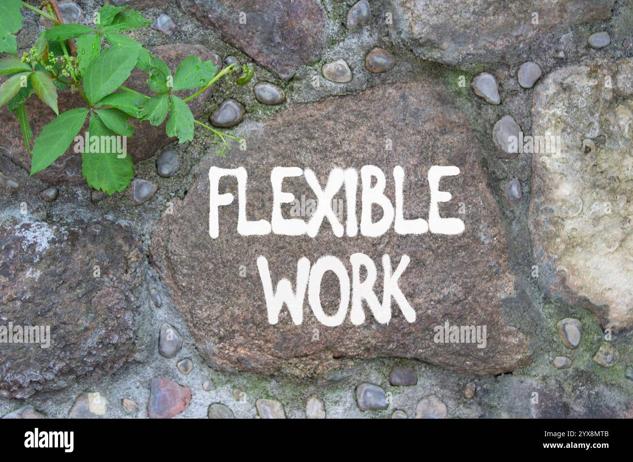 Flexible work symbol. Stone wall with words Flexible work. Beautiful ...