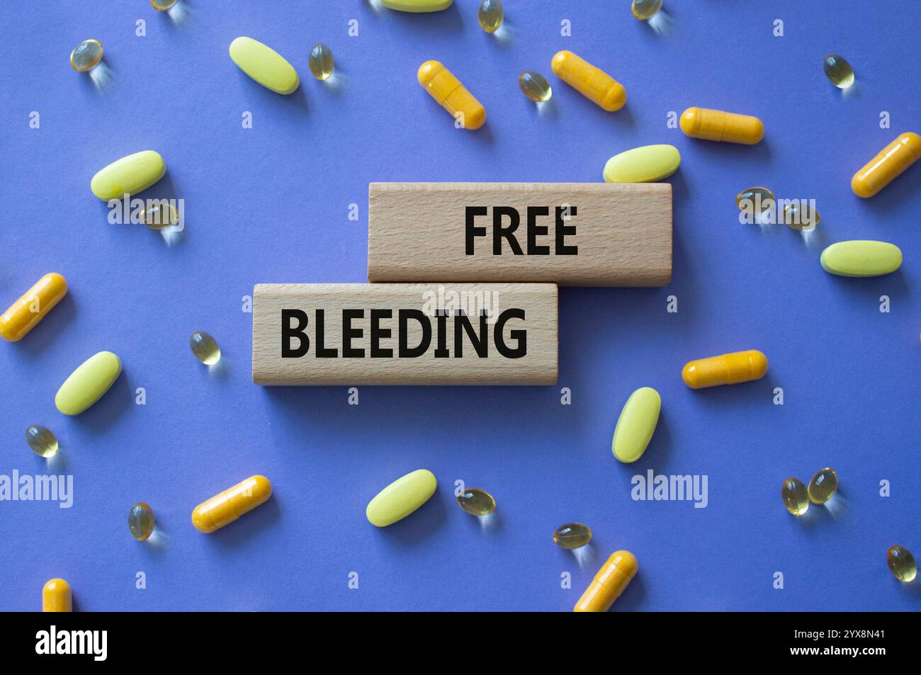 Free bleeding symbol. Concept words Free bleeding on wooden blocks ...