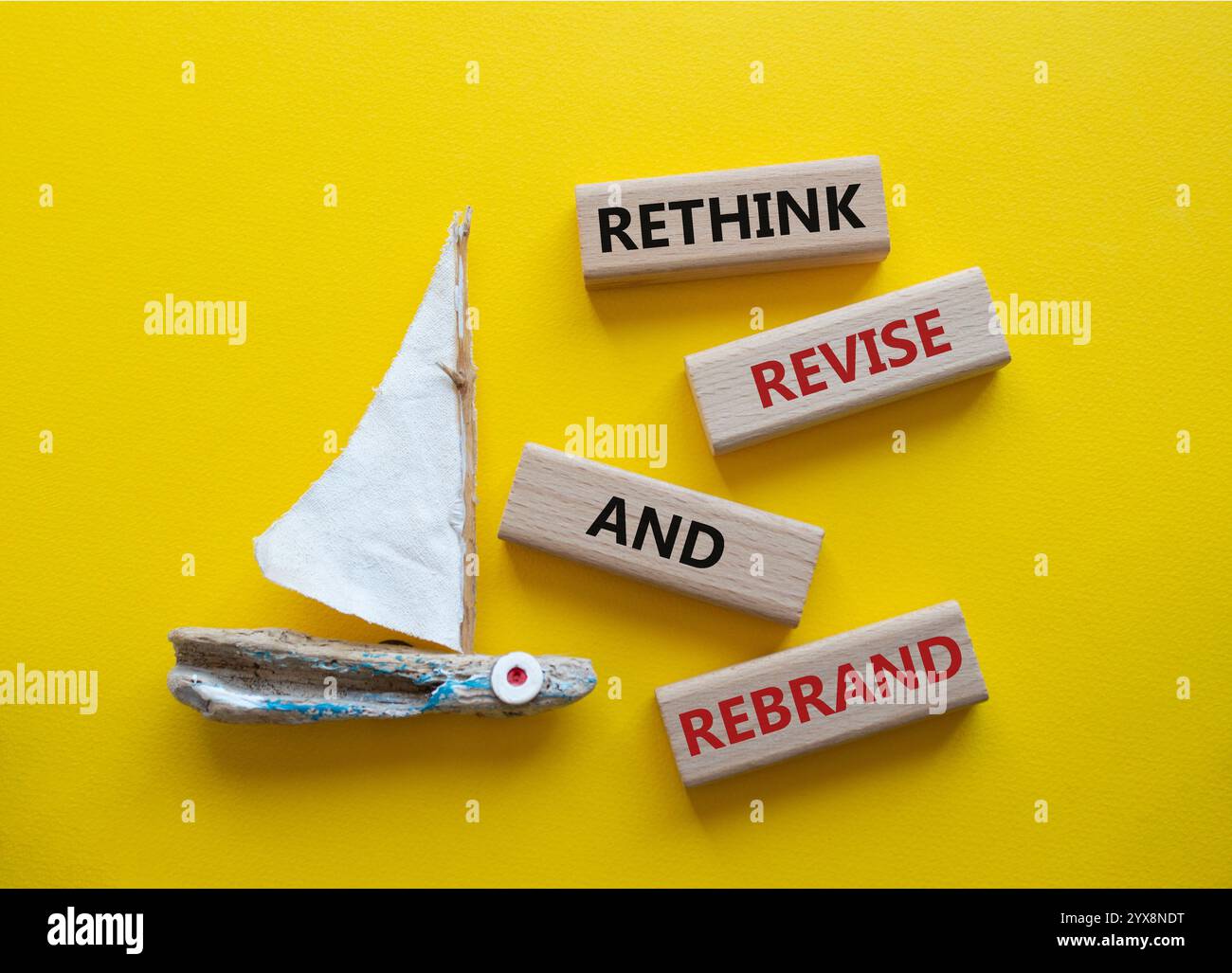 Rethink Revise and Rebrand symbol. Wooden blocks with words Rethink Revise and Rebrand ...