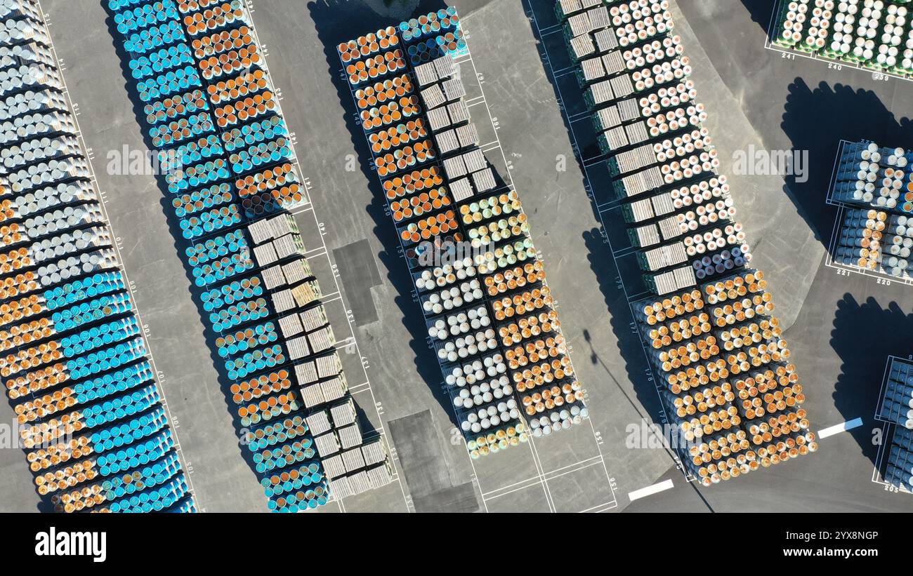 An aerial view of colorful, organized shipping containers in a busy ...