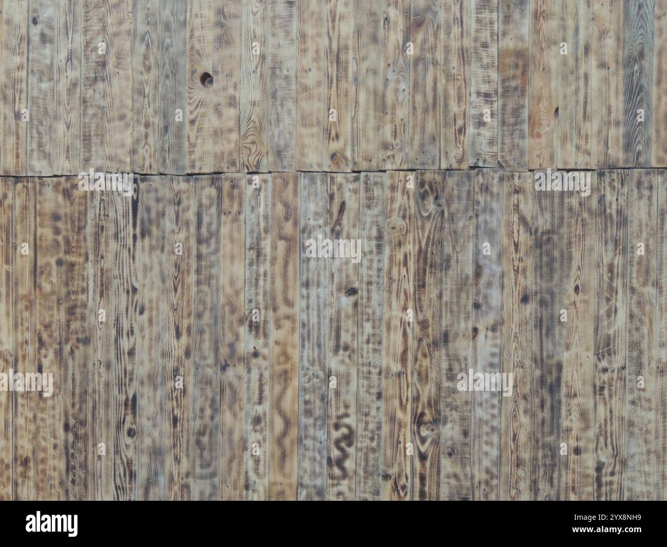 composite fence made of narrow stained boards with a unique beautiful ...