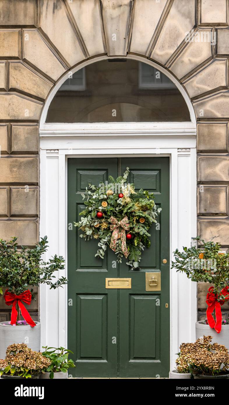 Georgian front panelled painted green door with fanlight and Christmas ...