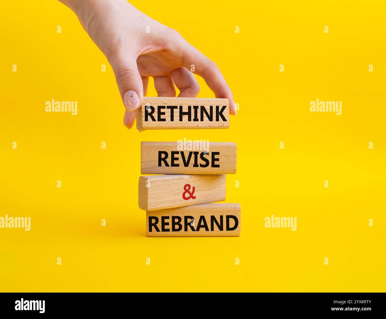 Rethink Revise and Rebrand symbol. Wooden blocks with words Rethink Revise and Rebrand ...