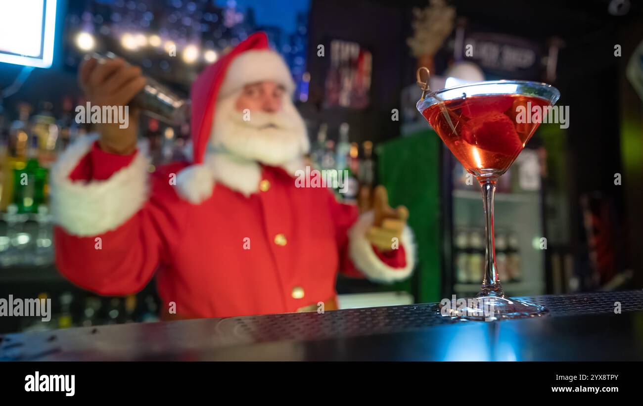 Santa Claus works at the bar making cocktails in a shaker Stock Photo ...