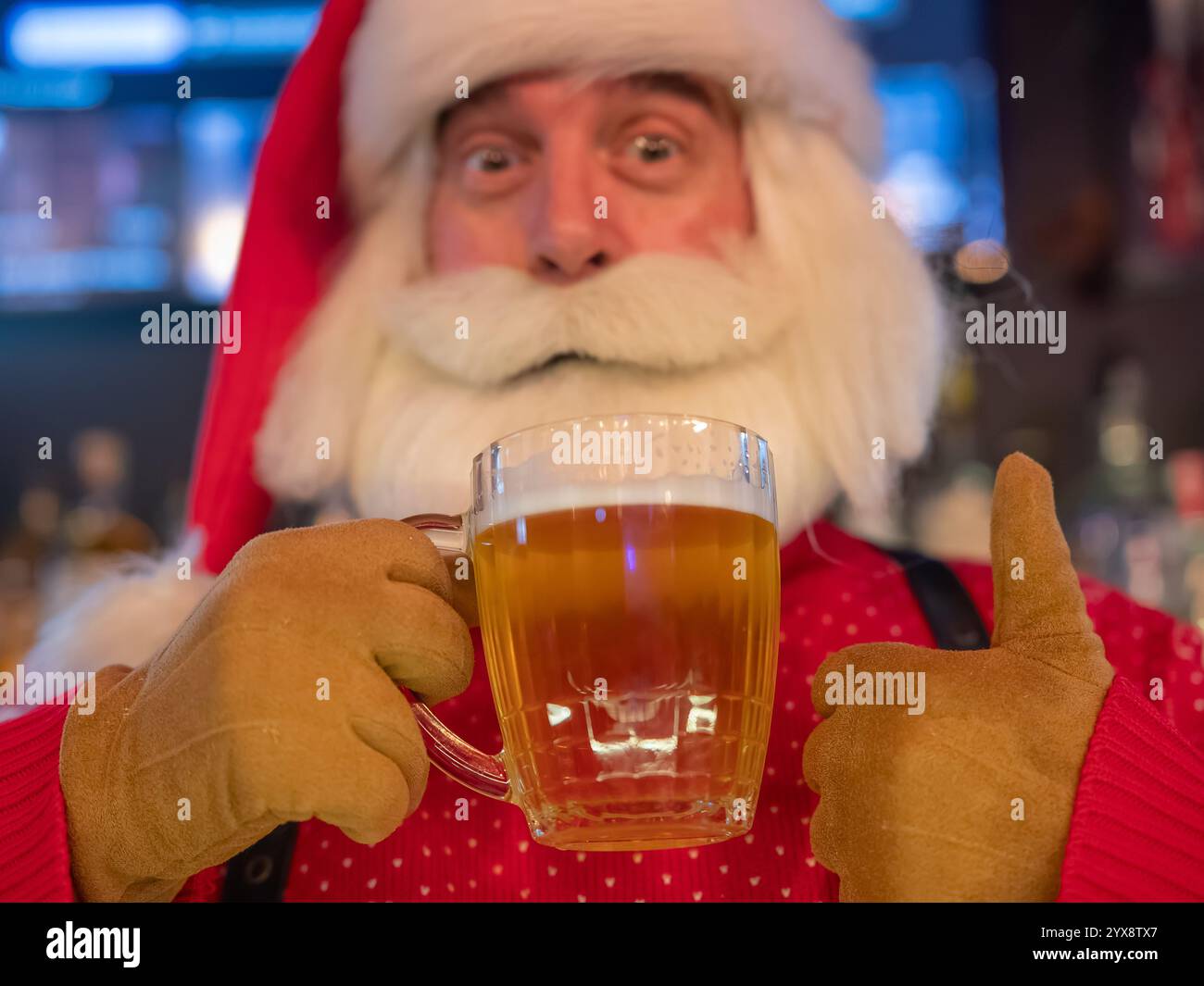 Santa Claus drinking beer at a bar Stock Photo - Alamy