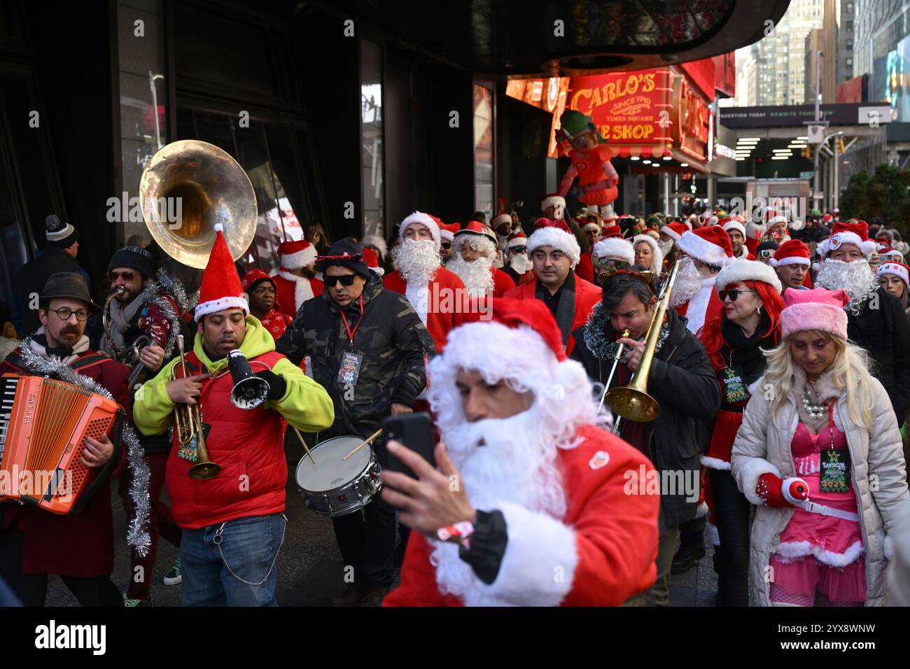 Photo by: NDZ/STAR MAX/IPx 2024 12/14/24 People dressed in Santa Claus ...