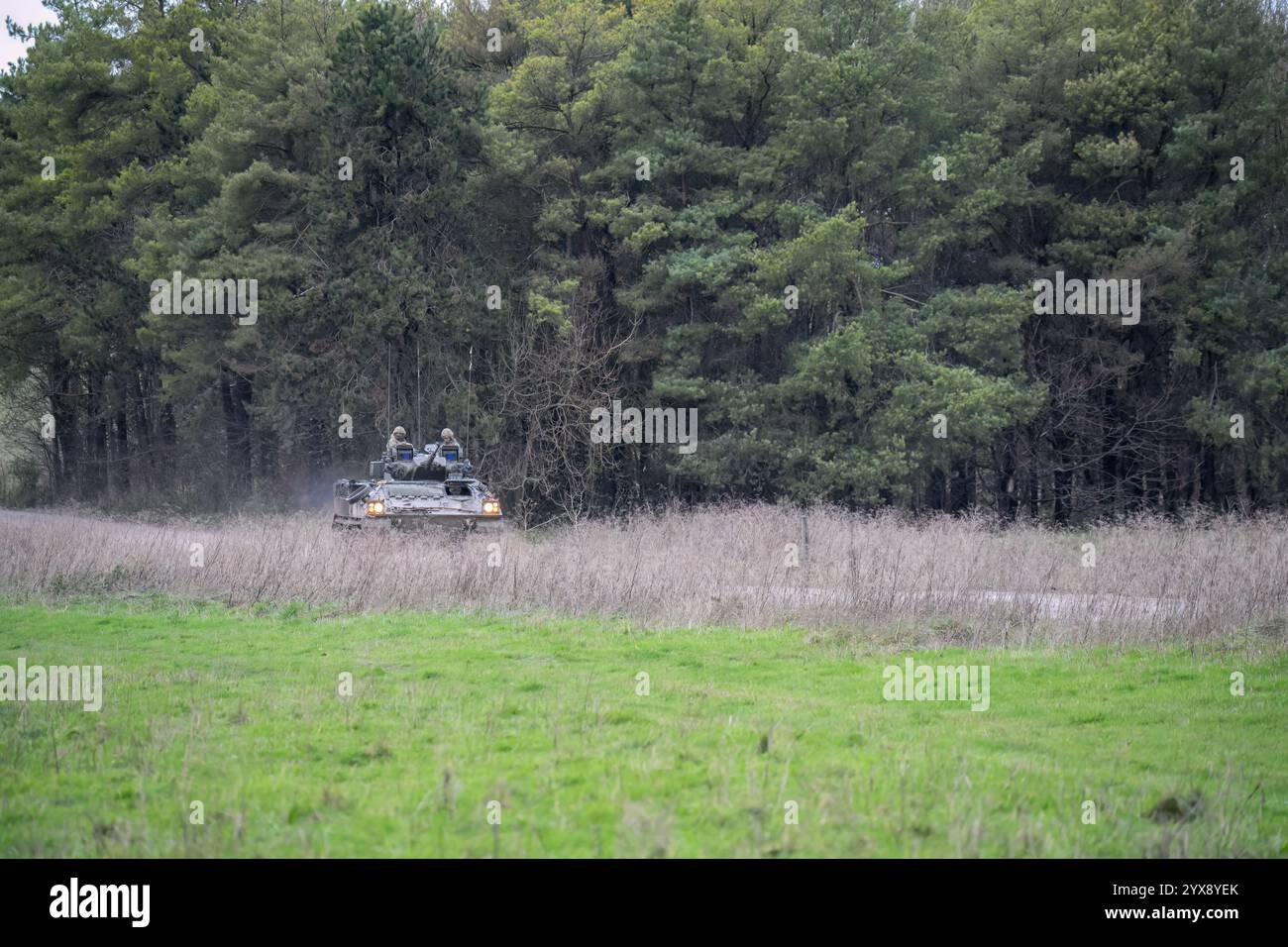 commander and gunner directing a British army Warrior FV510 IFV in ...