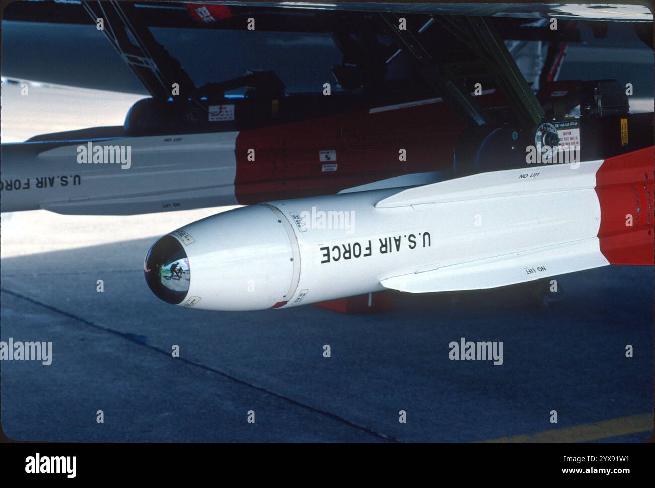 Closeup of front half of AIM-4G missile on extended rail. Missile is ...